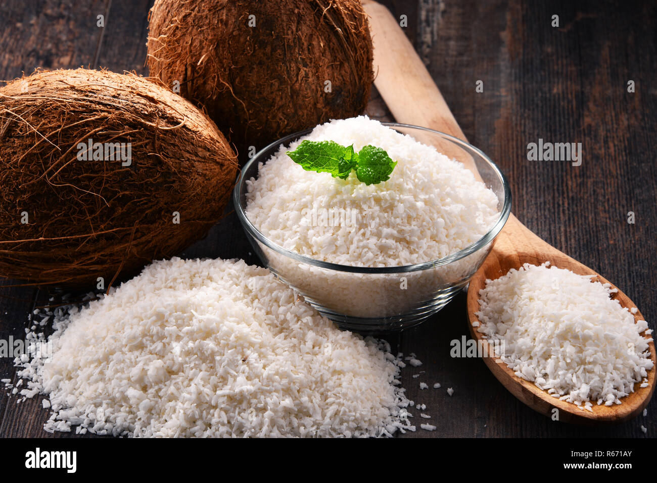 Composition with bowl of shredded coconut and shells Stock Photo - Alamy