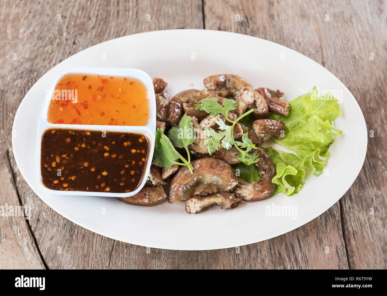 Top view Pig's intestines grilled thai style food Stock Photo - Alamy