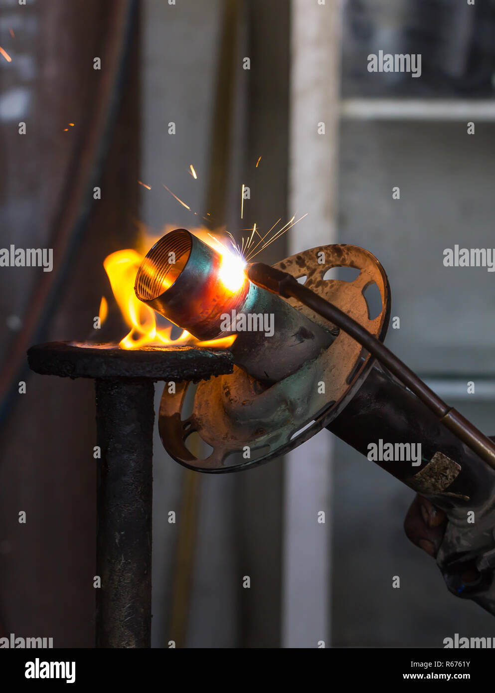 Welders were repairing Shock absorbers Stock Photo - Alamy
