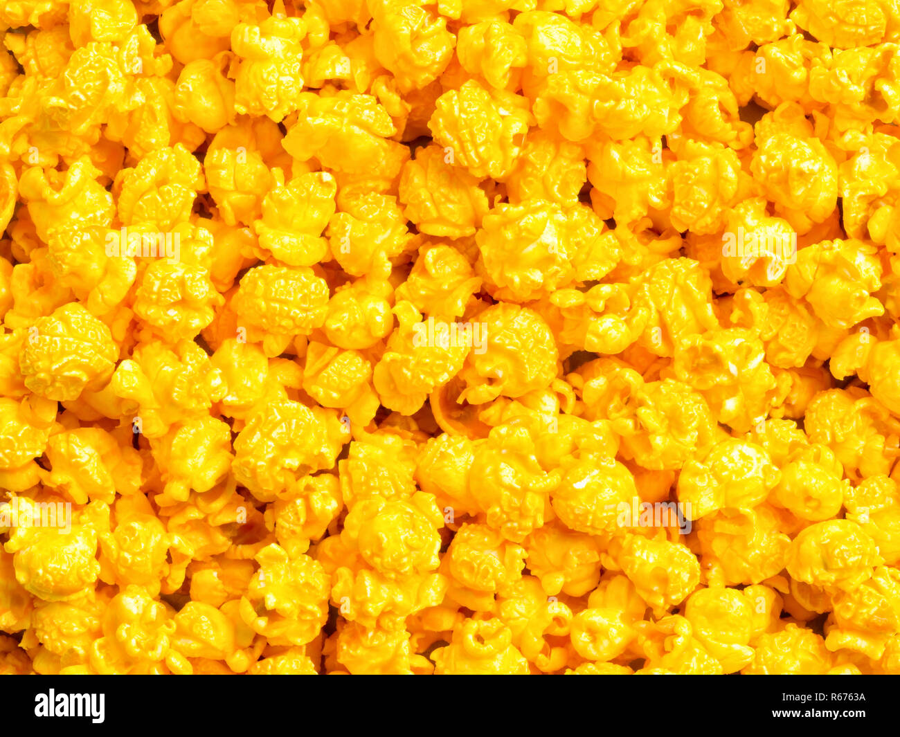 golden cheese popcorn food background Stock Photo - Alamy