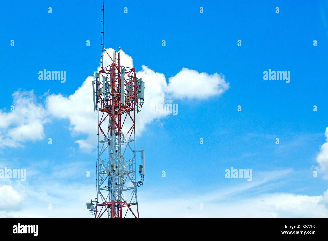 Signal towers in the blue sky Stock Photo - Alamy