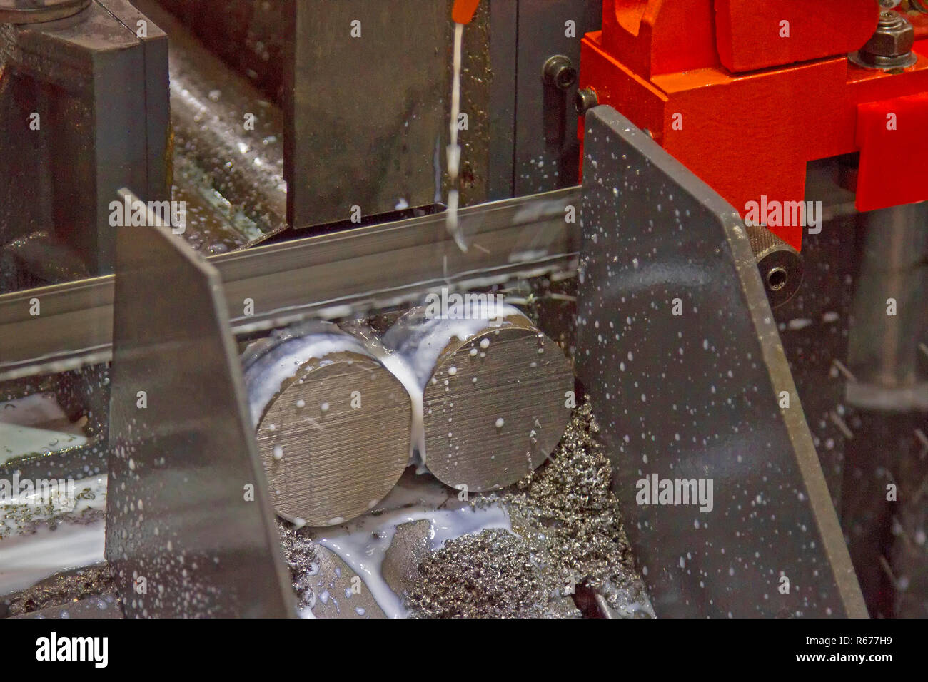 Hacksaw machine on cutting for round steel coolant in motion Stock ...