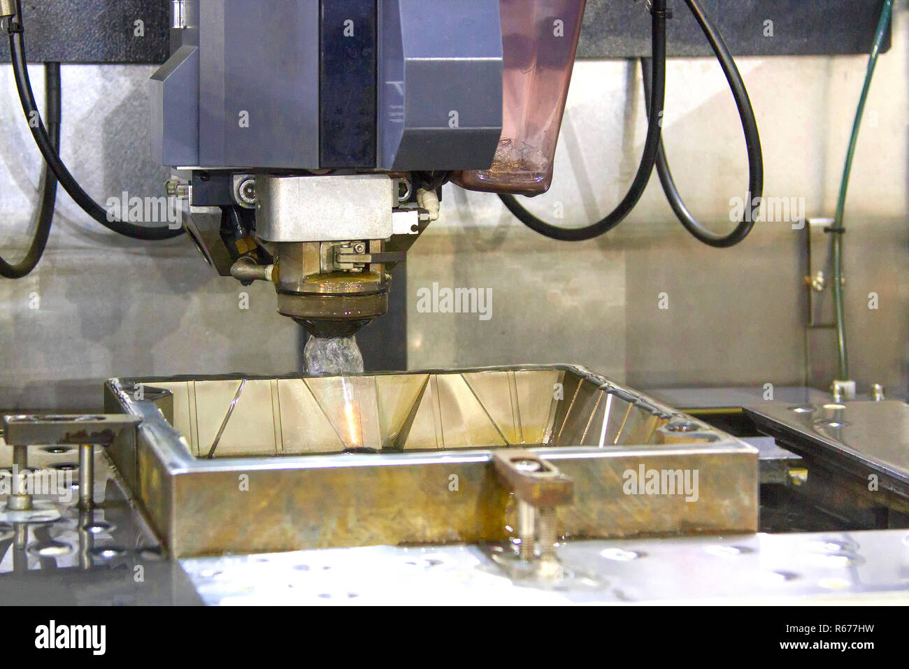 CNC wire cutter works in slender cutting of metal Stock Photo - Alamy