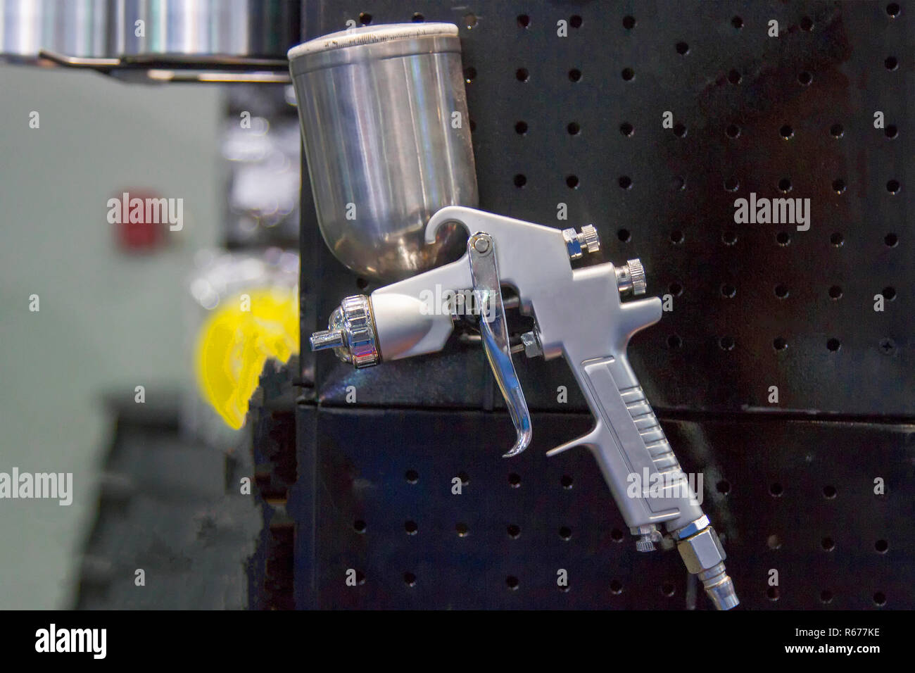 Spray gun for show with black background Stock Photo - Alamy