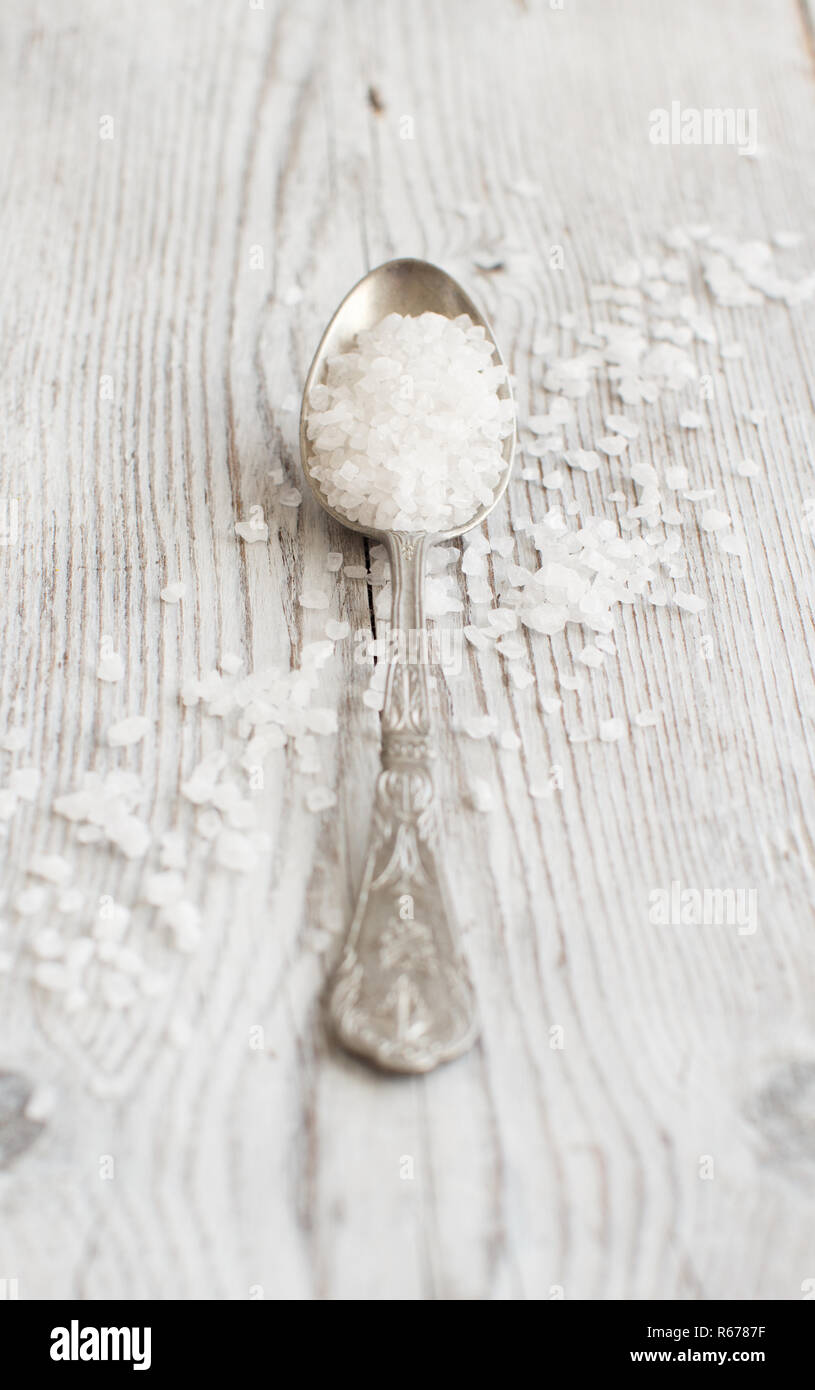Spoon of sea salt Stock Photo - Alamy