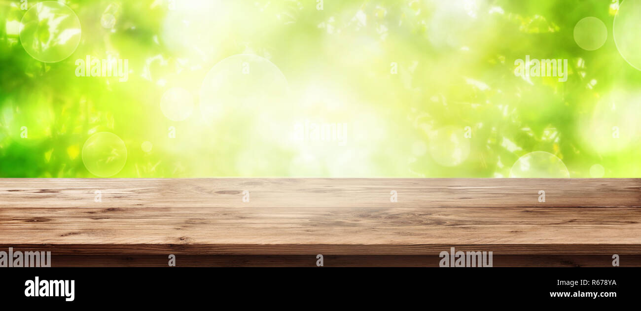abstract green background with wooden table Stock Photo - Alamy