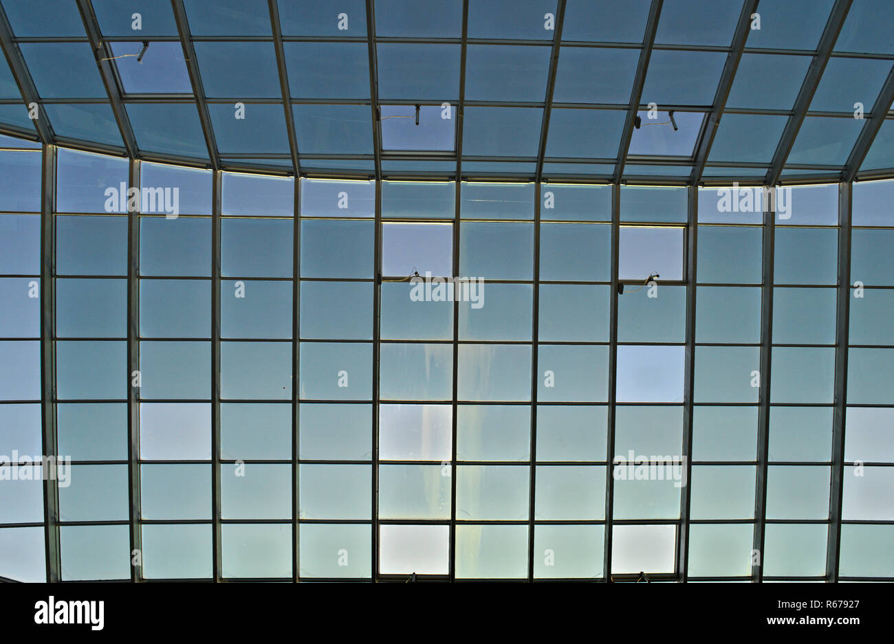 Huge glass roof inside building from bellow Stock Photo - Alamy