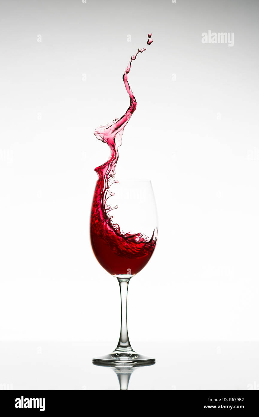 13. red wine splashing out of a glass Stock Photo - Alamy