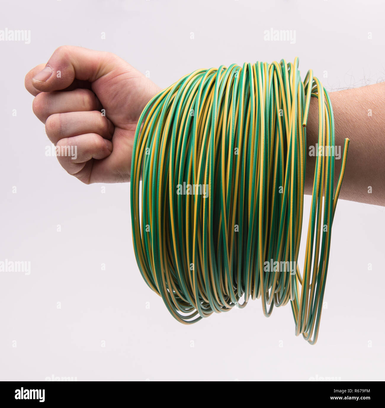 roll of electric cable in hand Stock Photo - Alamy