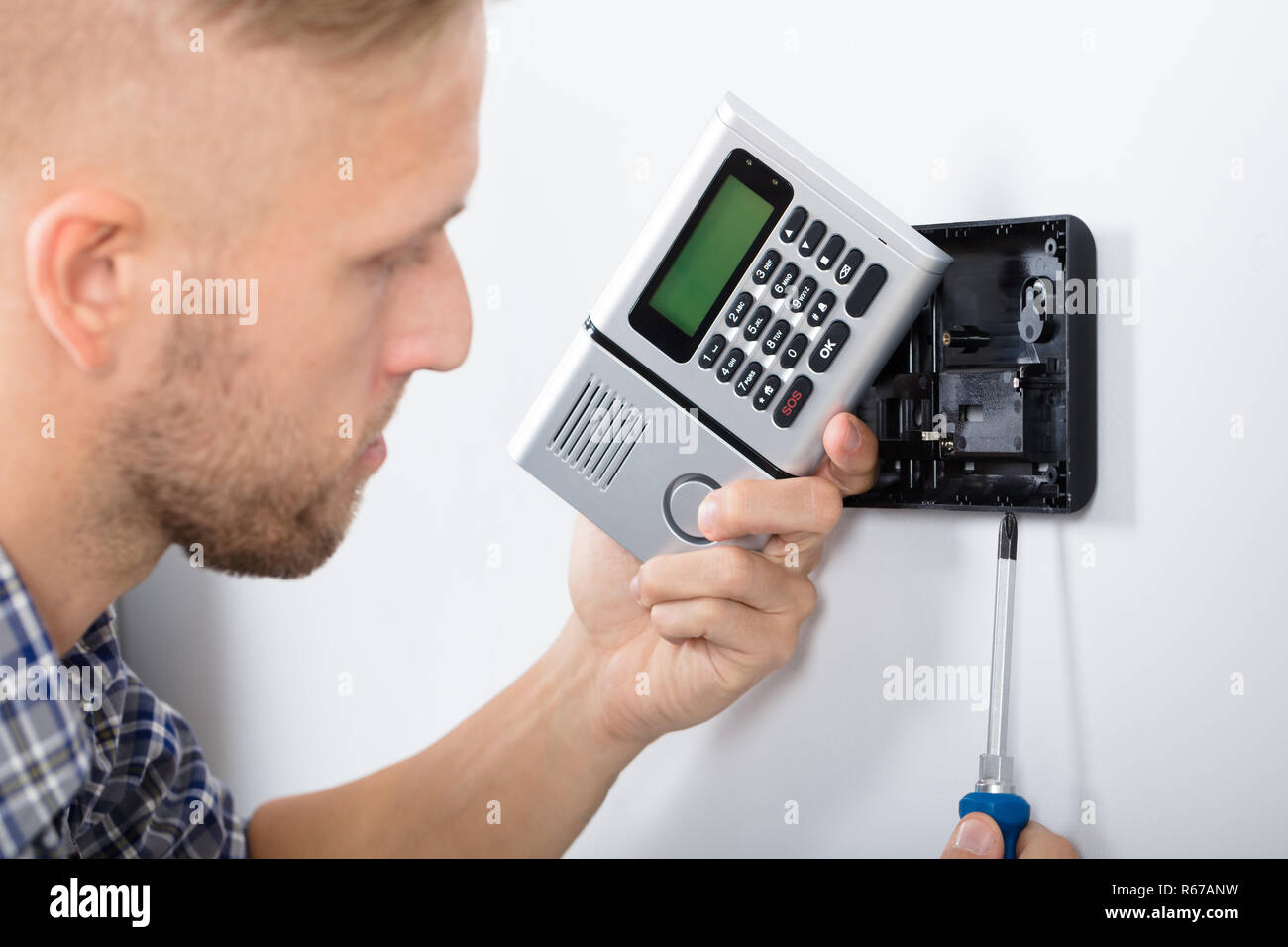 Male Technician Installing Security System Stock Photo - Alamy Male Technician Installing Security System Stock Photo - Alamy