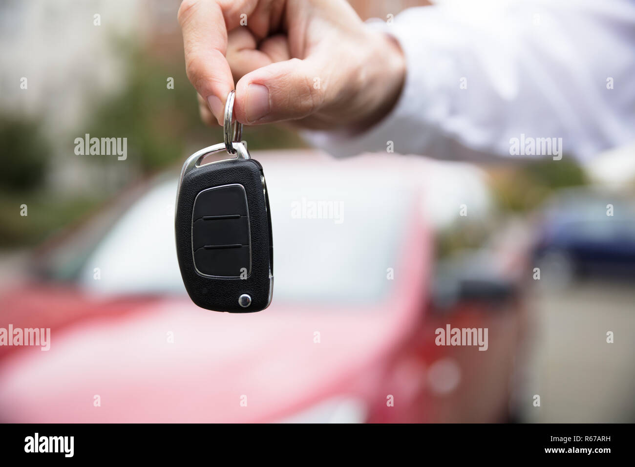 Person's Hand Holding Car Key Stock Photo - Alamy
