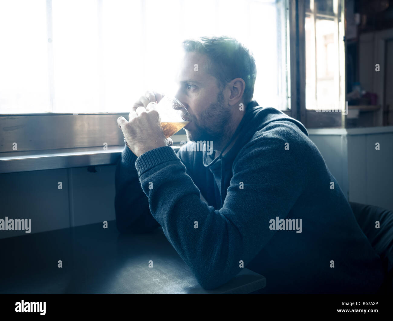 Unhappy man in pub portrait hi-res stock photography and images - Alamy