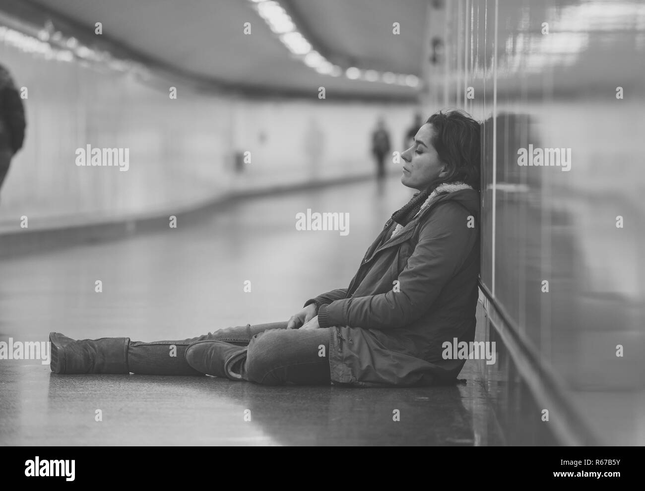 Young adult felling shame depressed and hopeless sitting alone on ...