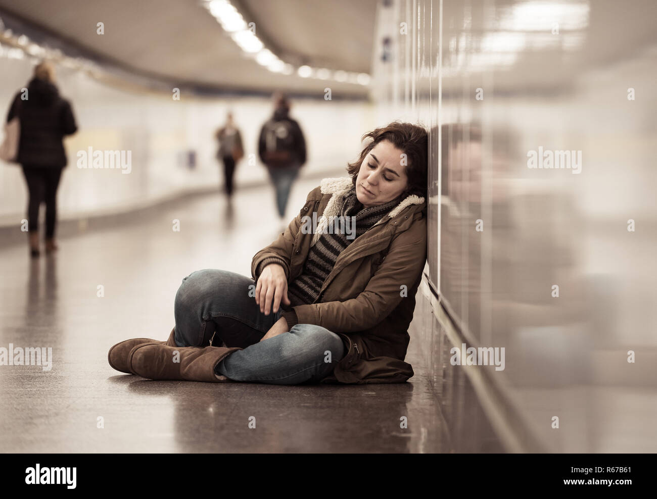 Young adult felling shame depressed and hopeless sitting alone on ...