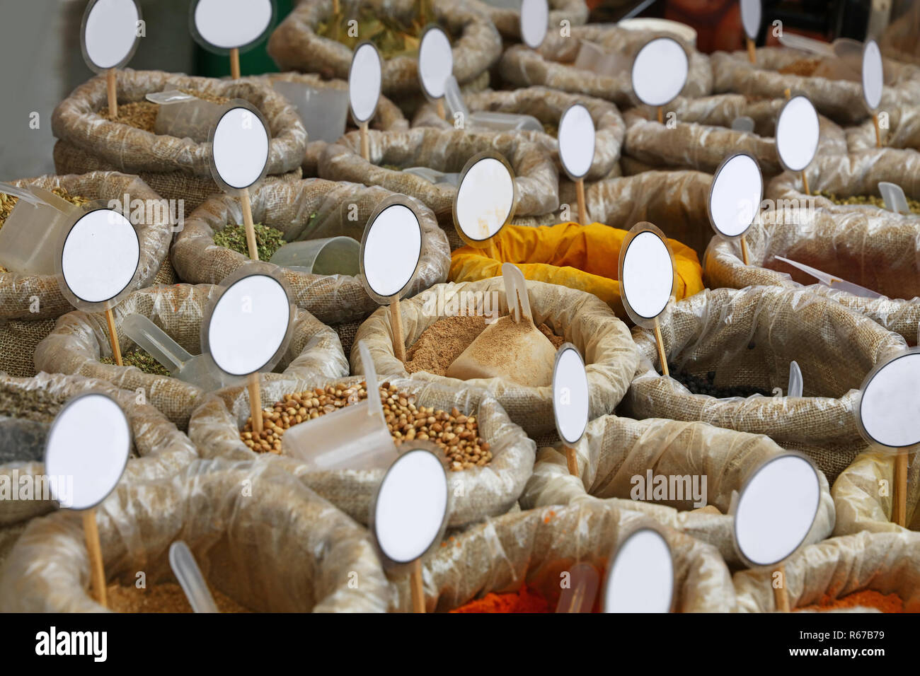 Close up bags of spices with blank price tags Stock Photo - Alamy