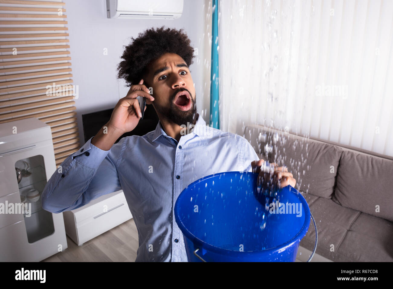 Water dripping into bucket hi-res stock photography and images - Alamy