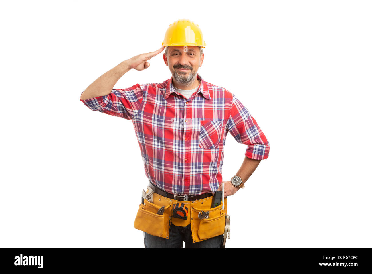 Playful constructor with palm at forehead as military salute as ...
