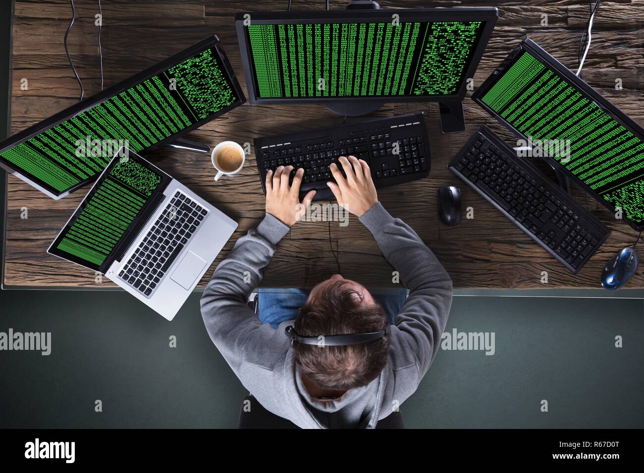 Hacker Stealing Data From Multiple Computer Stock Photo - Alamy