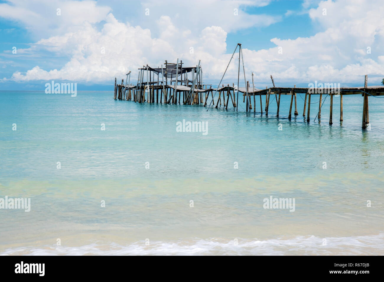 Wooden bridge of old on beach with the sky Stock Photo - Alamy