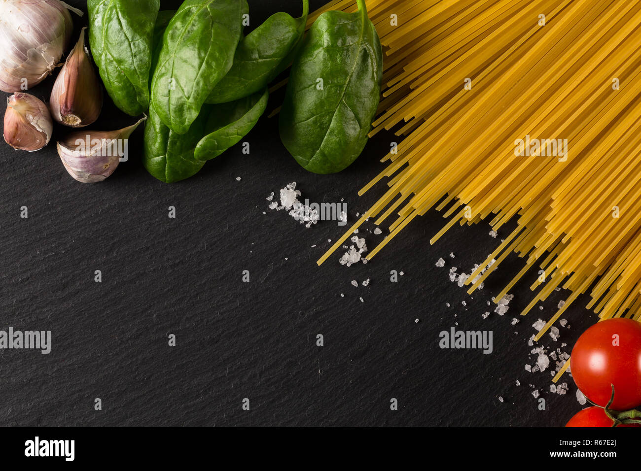 Culinary background for pasta, tomato, herbs and spices Stock Photo - Alamy