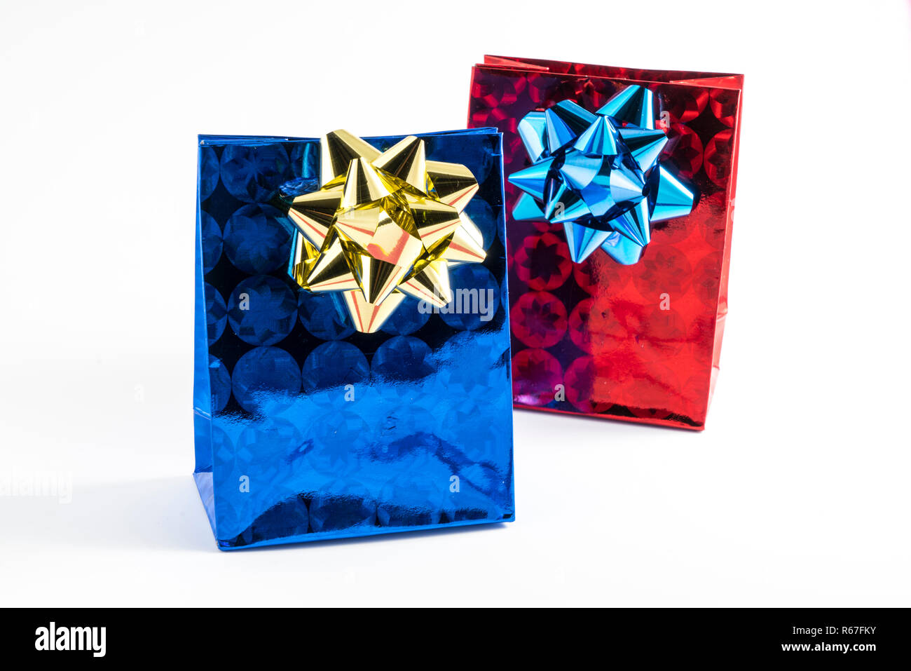 Tiny gold wrapped gift and object Cut Out Stock Images & Pictures - Alamy