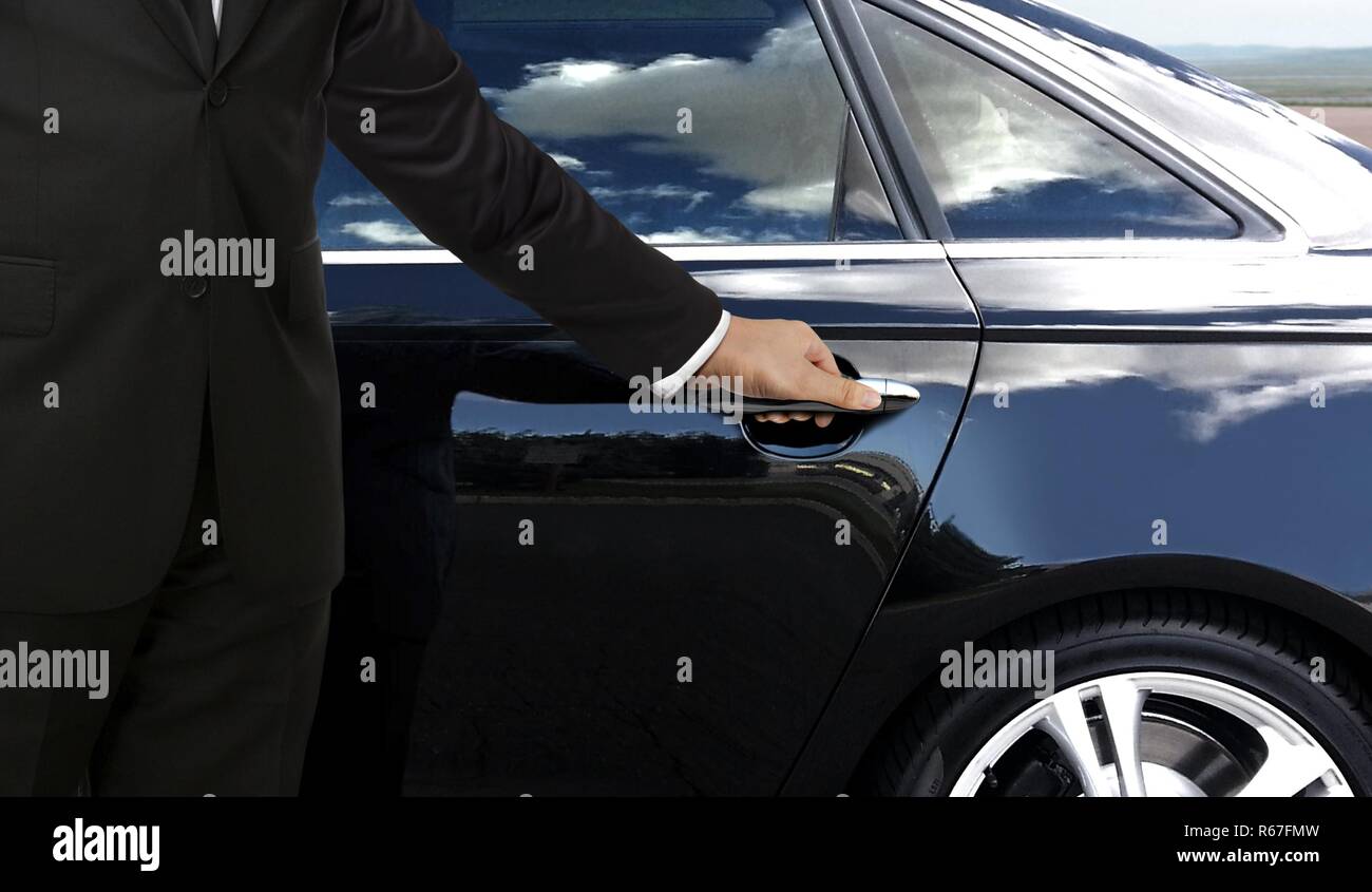 Driver hand opening car door Stock Photo - Alamy