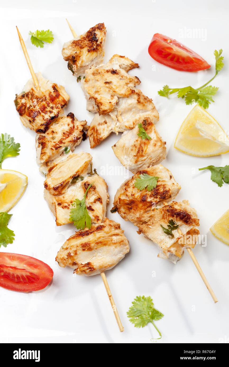 grilled chicken spit with cilantro Stock Photo - Alamy