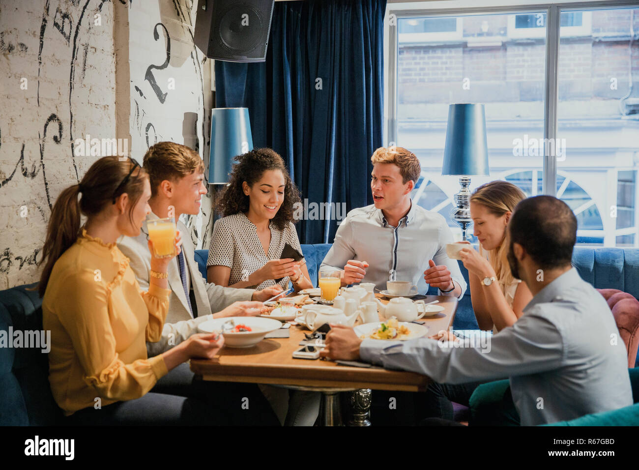 Friends Enjoying Breakfast Together Stock Photo - Alamy