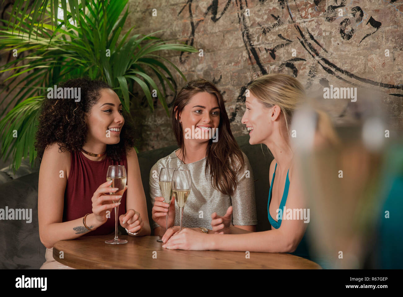 Friends Enjoying Drinks Stock Photo - Alamy