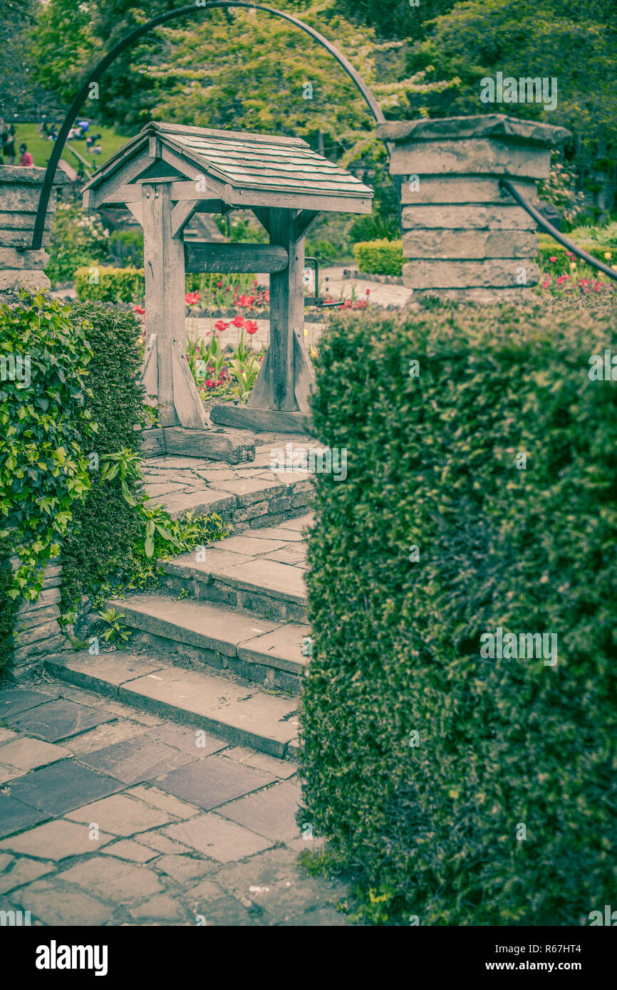 Old well in the park Stock Photo - Alamy