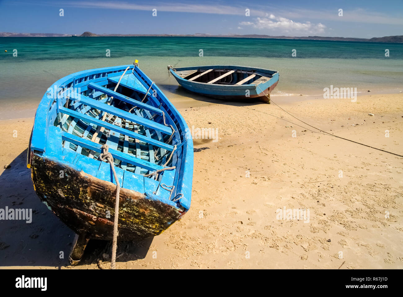 Blue boats on the shore Stock Photo - Alamy
