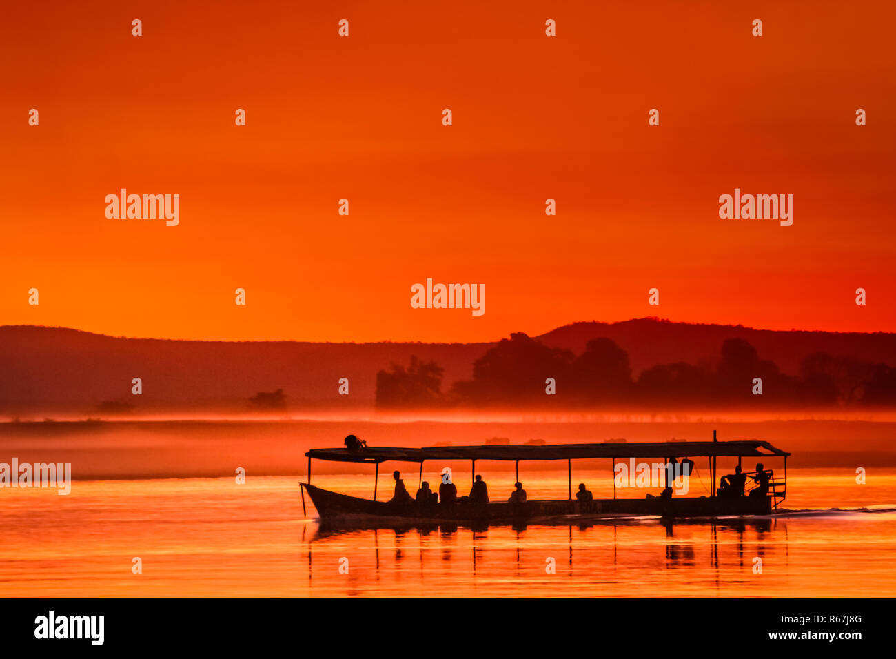Boat at sunset Stock Photo - Alamy