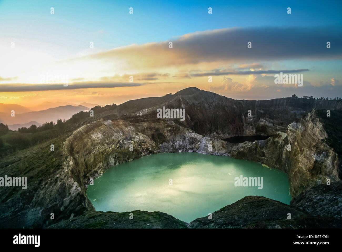 Crater of the kelimutu volcano at sunrise hi-res stock photography and ...