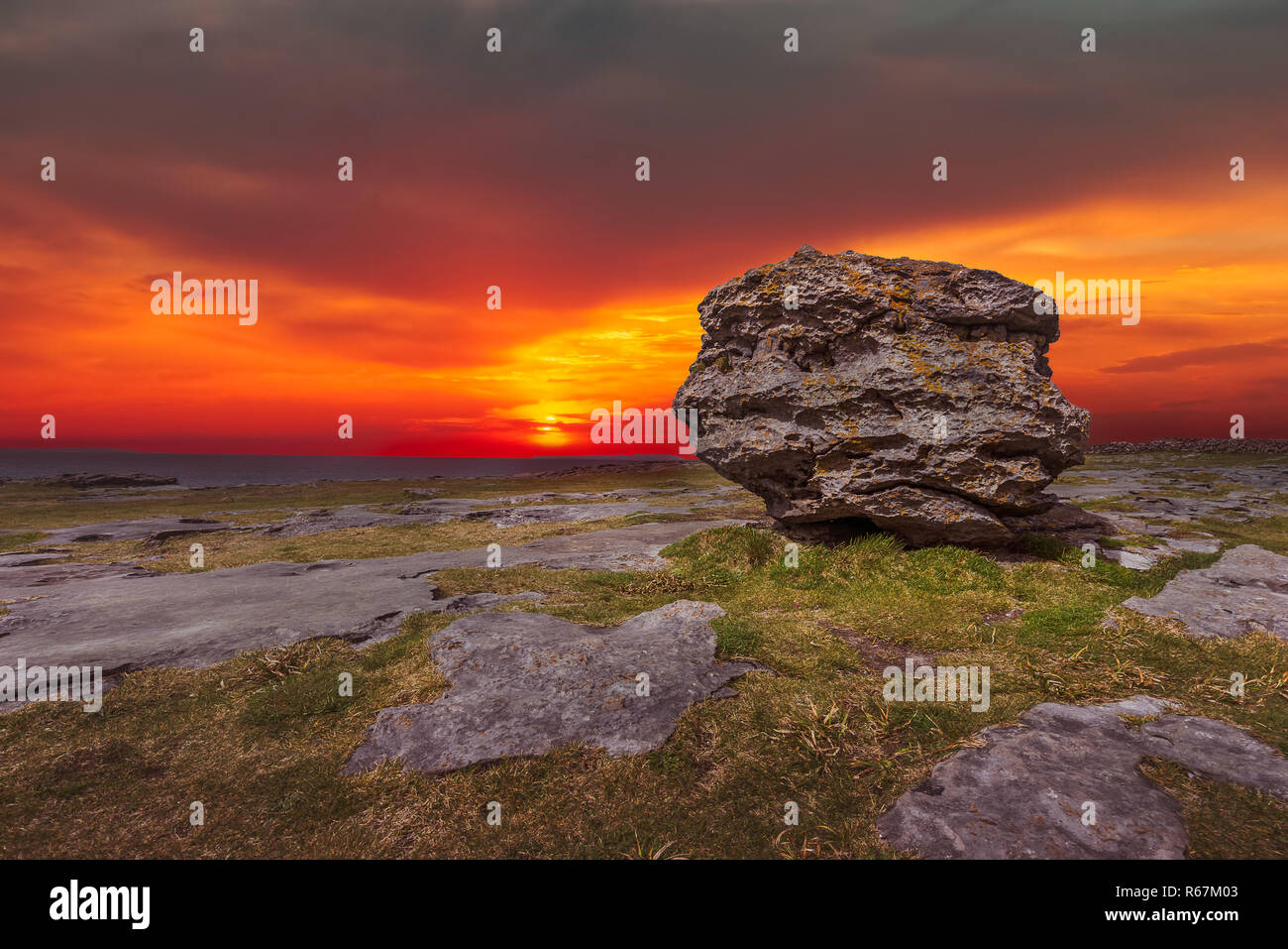 Huge limestone glacial erratic boulder at dusk Stock Photo - Alamy