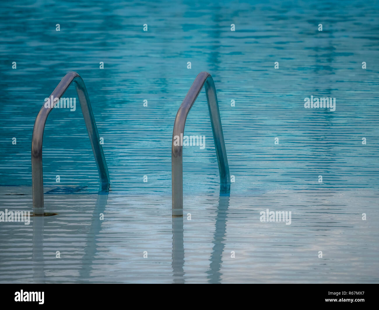 Swimming pool ladder Stock Photo - Alamy