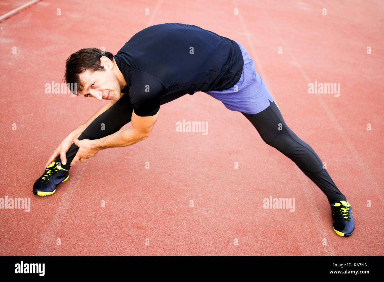 stretching in stadium Stock Photo - Alamy