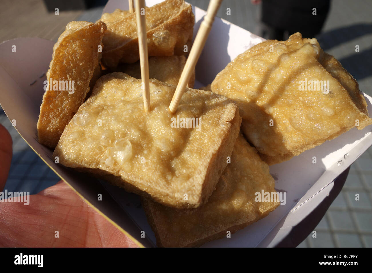 Stinky fried tofu at a Shanghai street Stock Photo - Alamy