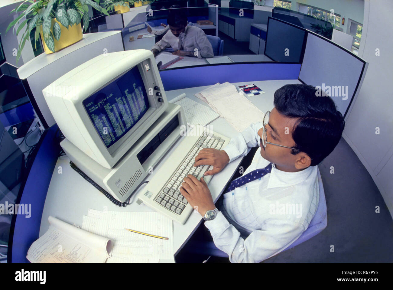 Man working on Computer Stock Photo - Alamy