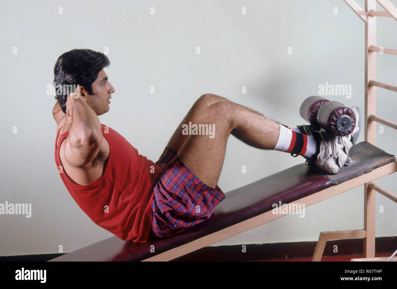 Indian man exercising in the gymnasium Stock Photo - Alamy