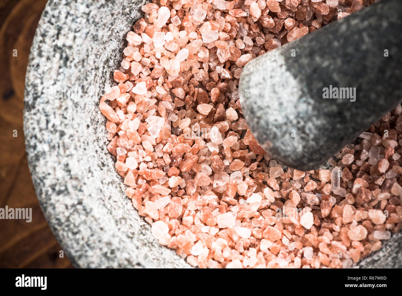 Himalayan pink salt seed in granite mortar or pestle Stock Photo - Alamy