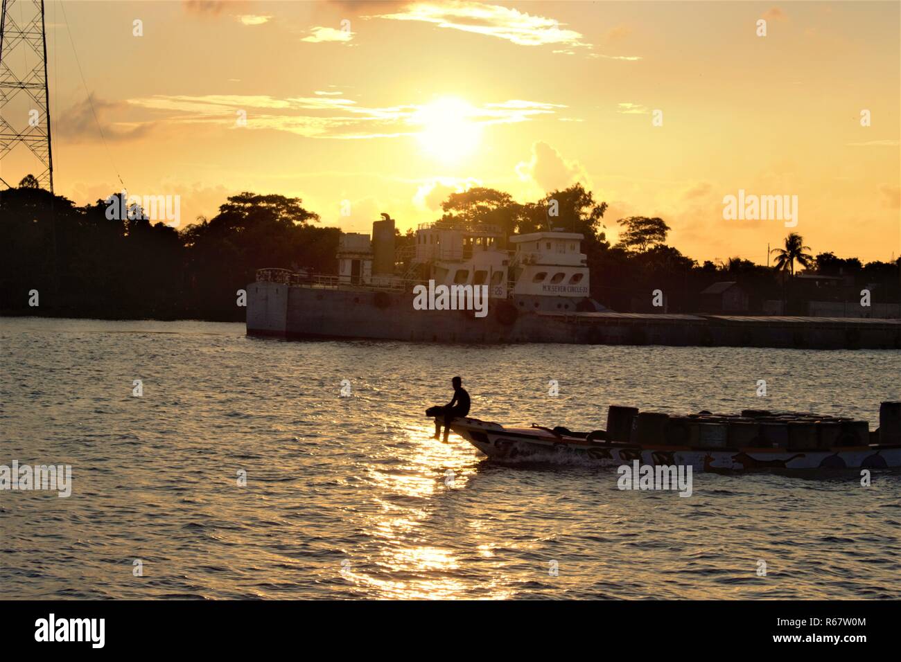 A boy setting in the boat Stock Photo - Alamy