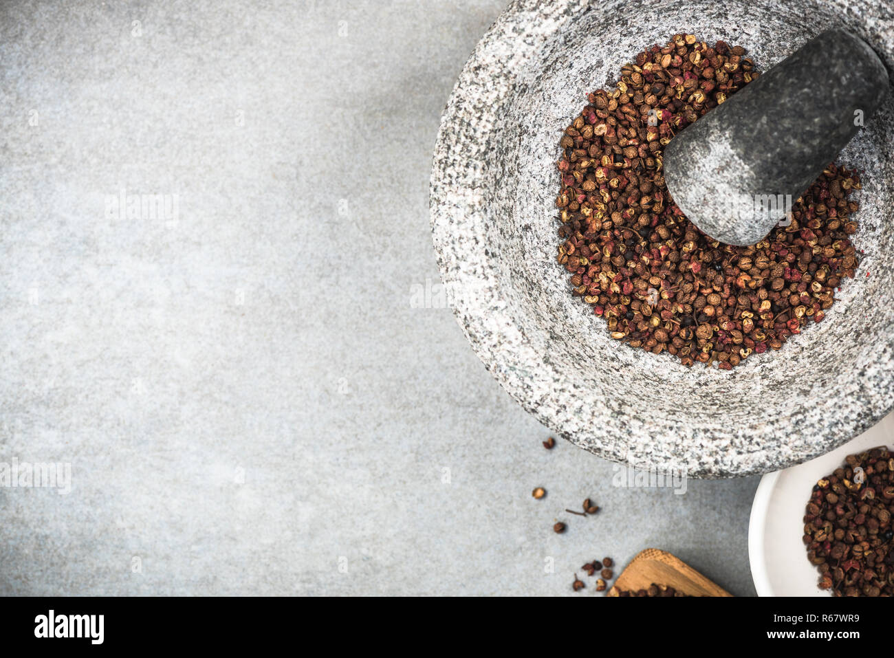 Timut sihuan pepper seeds in granite pestle or mortar Stock Photo - Alamy