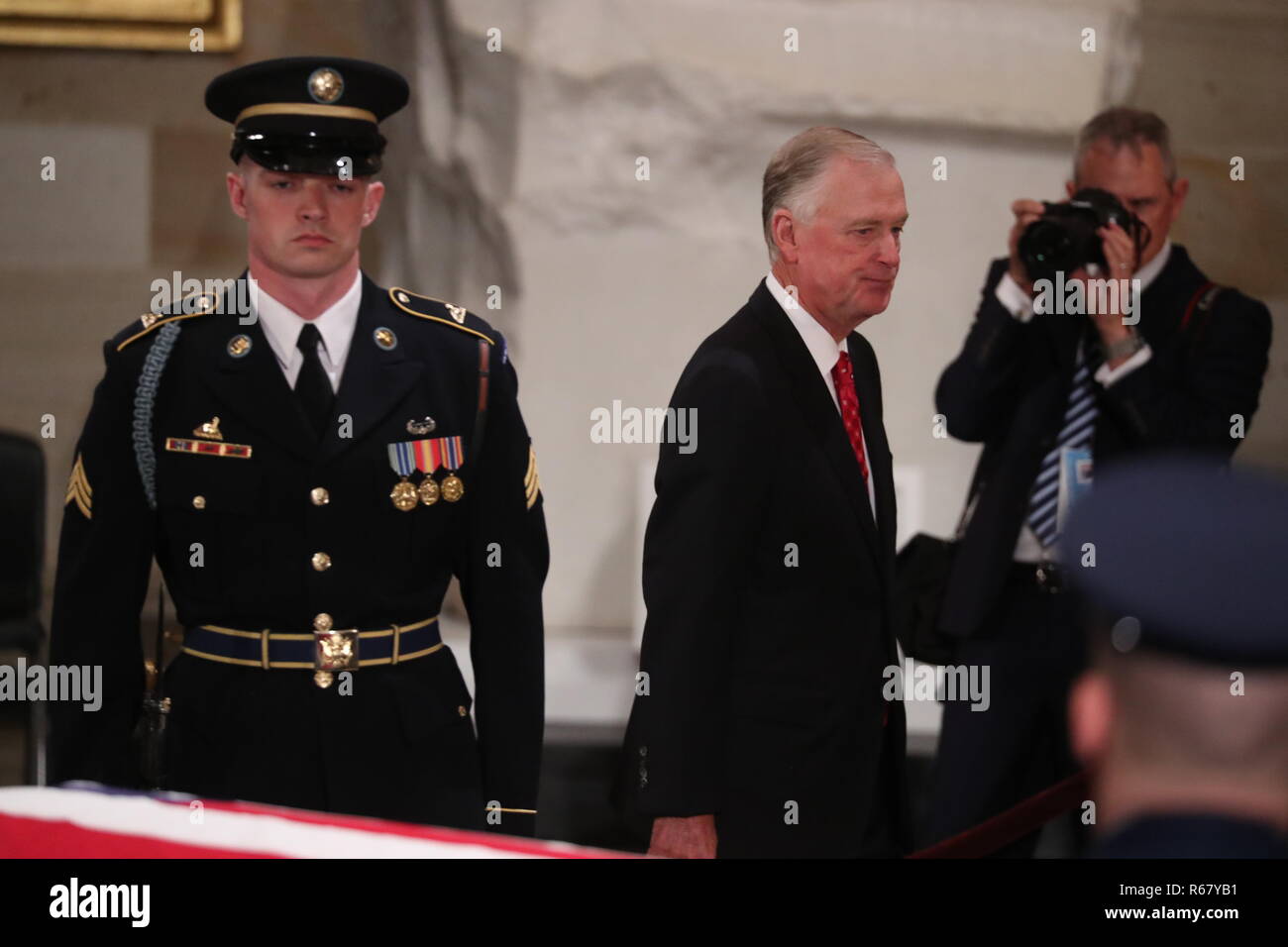 Former U.S. Vice President Dan Quayle walks past the casket of former ...