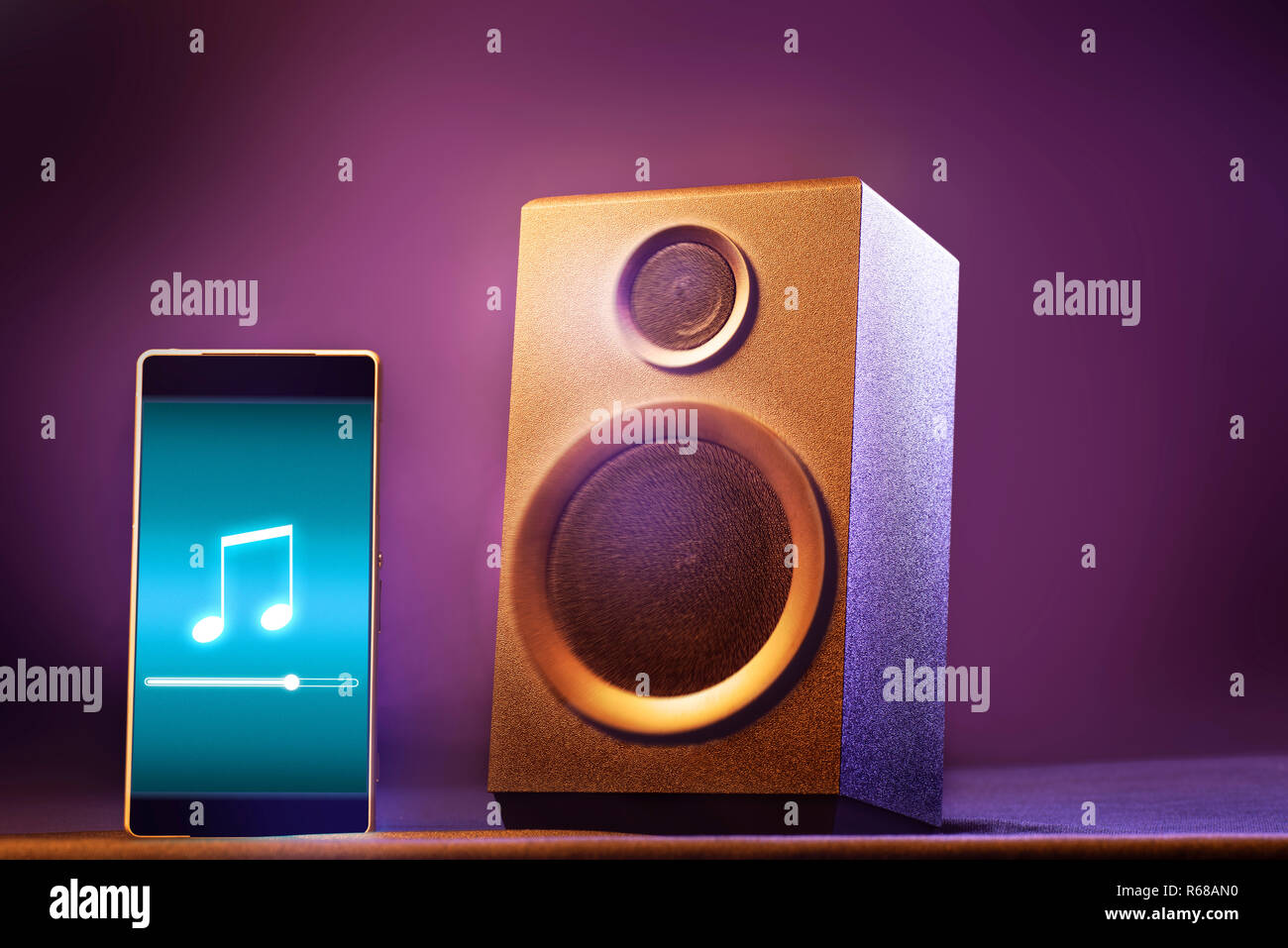 Smart phone playing music with bluetooth speaker. Lifestyle concept ...