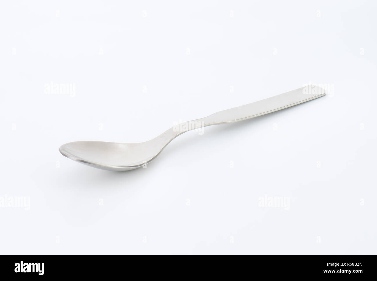 Small empty spoon Stock Photo - Alamy