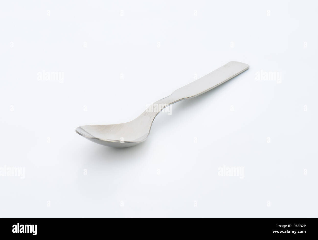 Small empty spoon Stock Photo - Alamy