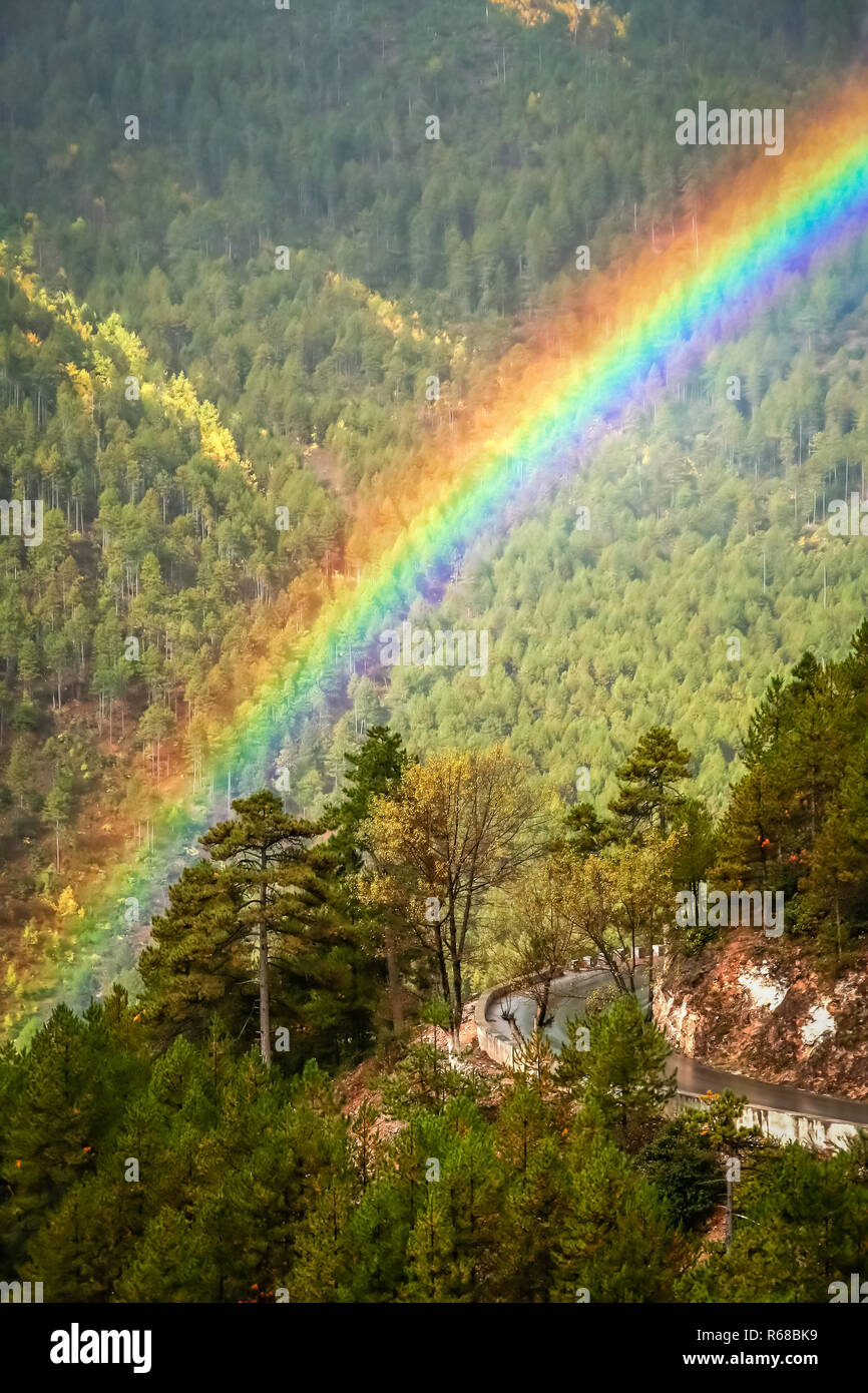 Rainbow over road Stock Photo - Alamy