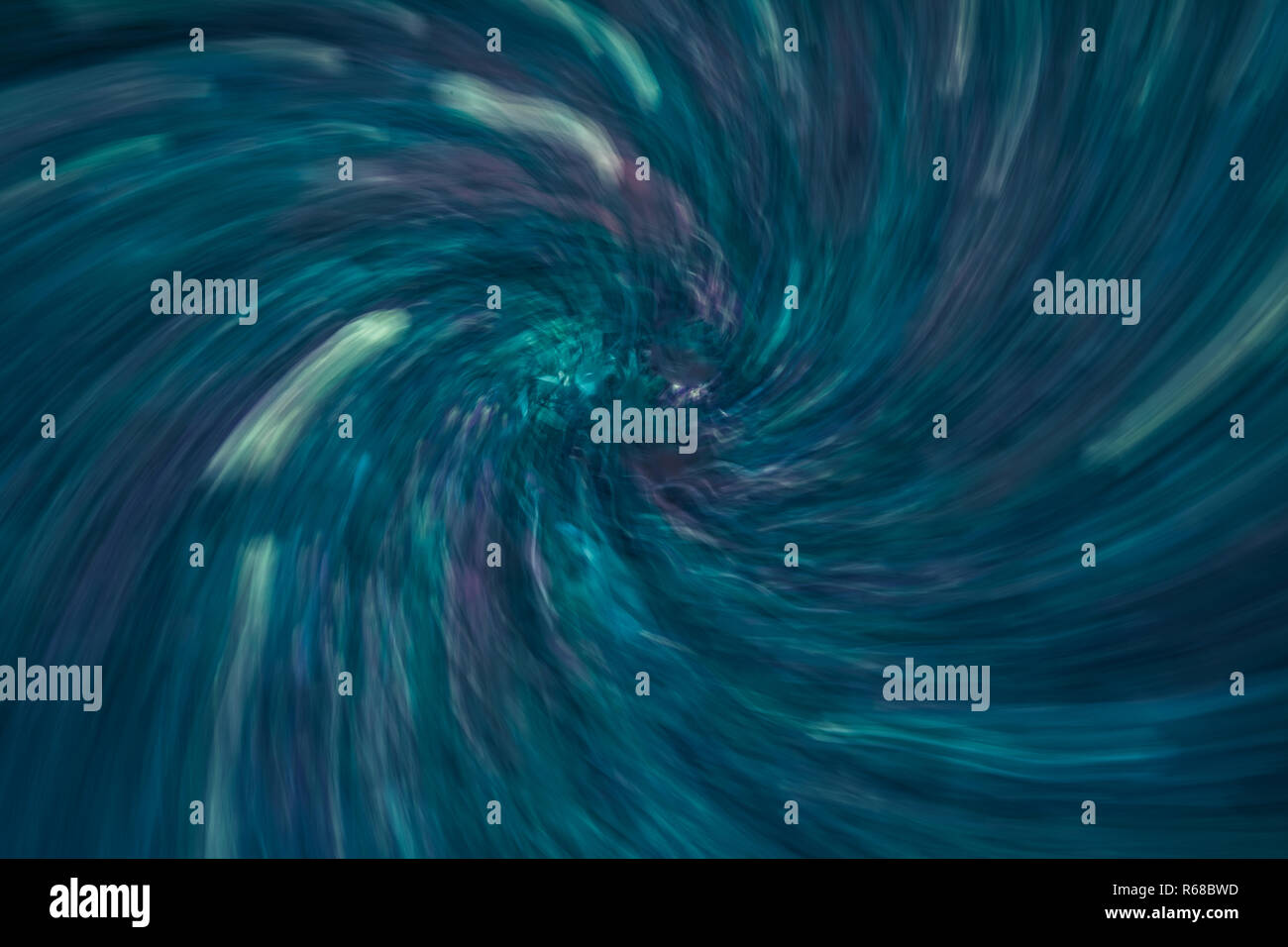 Blue glowing spinning spiral hi-res stock photography and images - Alamy