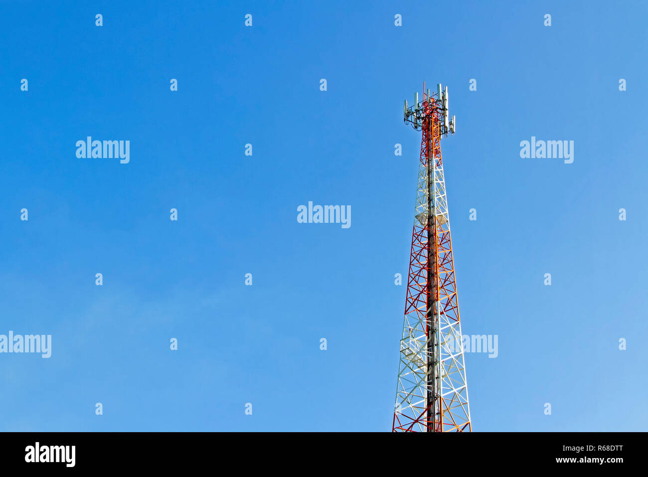 Mobile phone communication tower transmission signal with blue sky ...