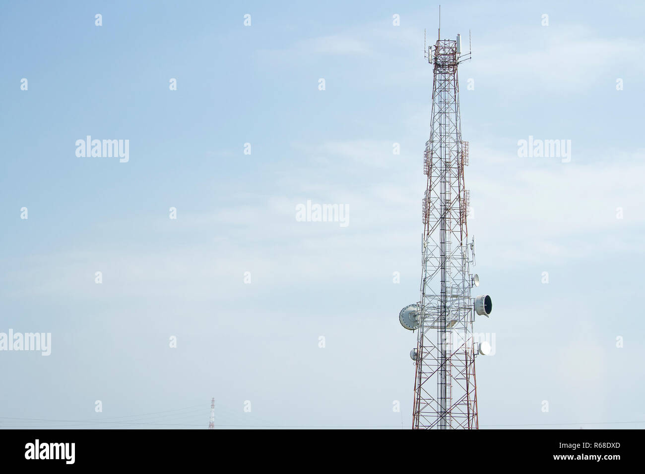 Mobile phone communication tower transmission signal with blue sky ...